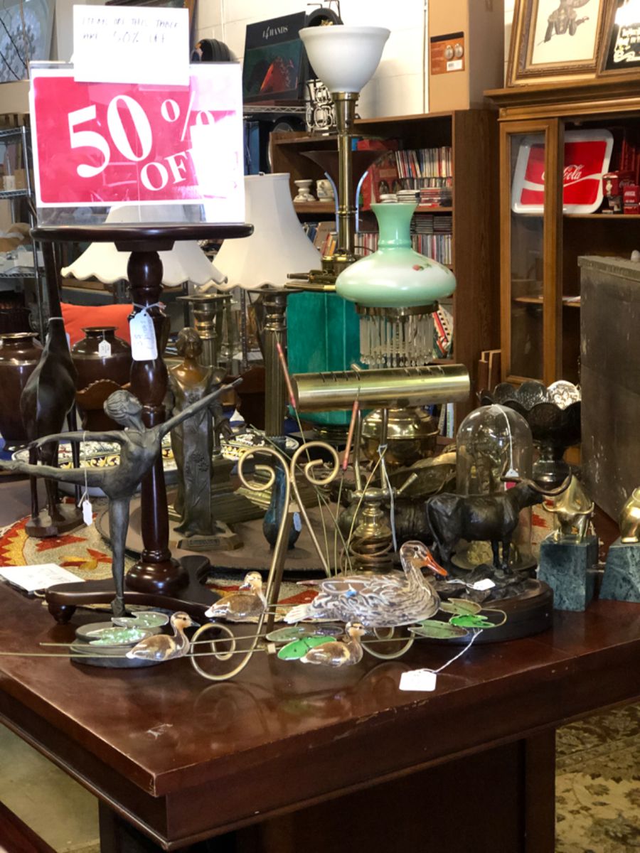Table full of Quality Decor 50% off. HUGE... starts on 8/17/2024